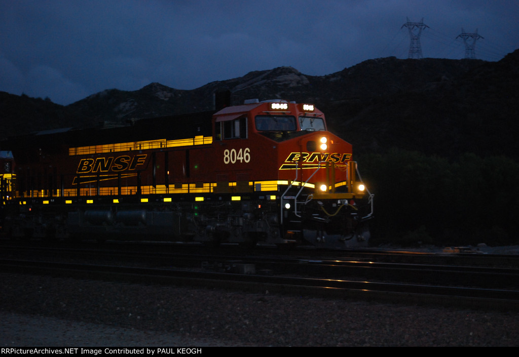BNSF 8046 Lights Up Her BNSF Swoosh Reflective Logo as she Heads eastbound towards Sullivan's ...